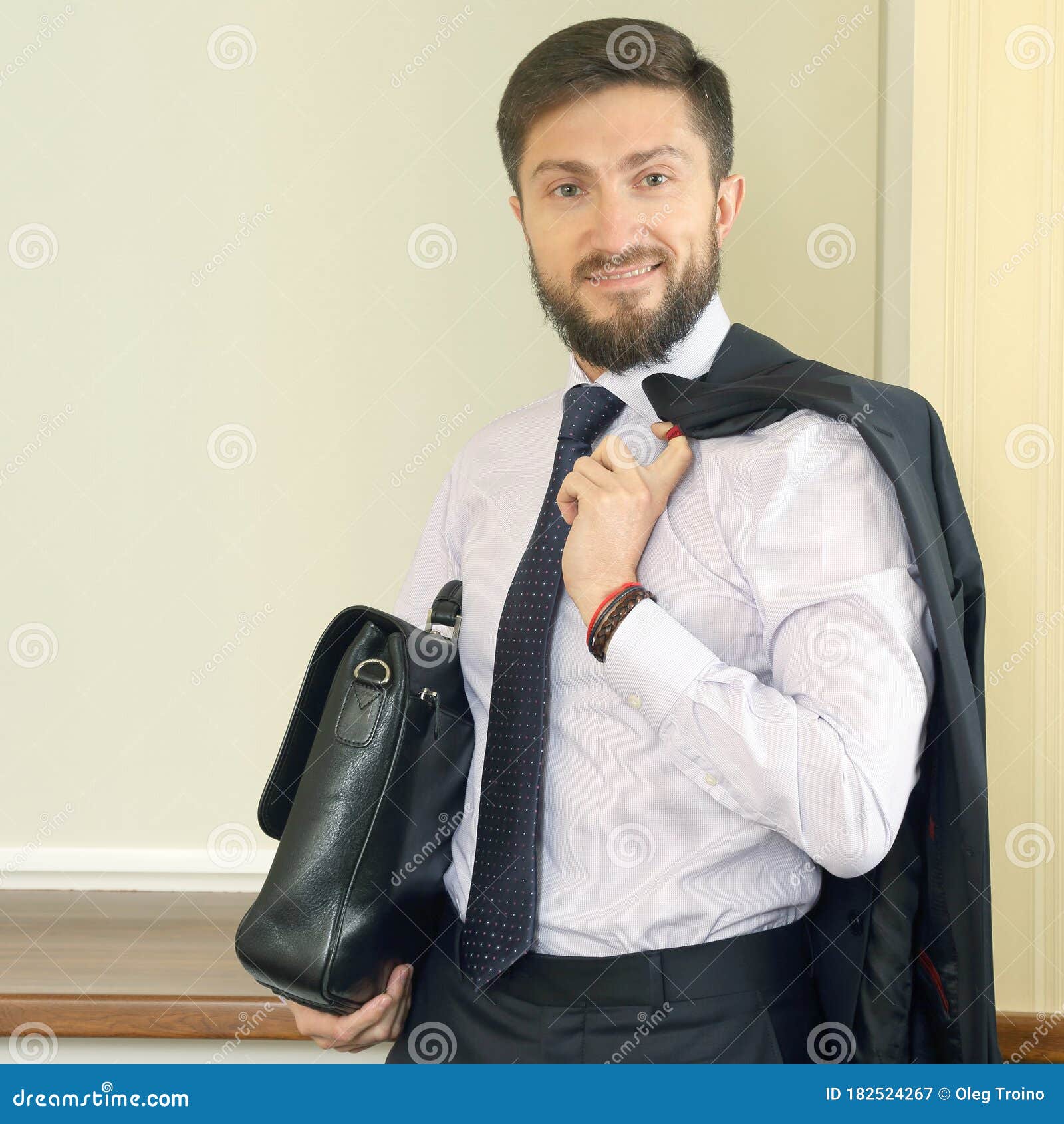 Successful Business Man with a Briefcase and Suit in the Hands Stock ...