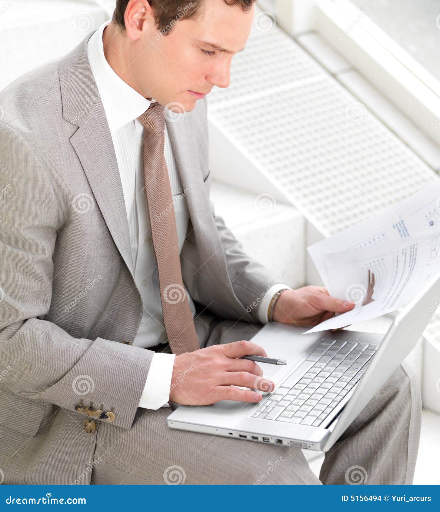 Successful Business Man Going Over Paper Work Stock Photo - Image of ...