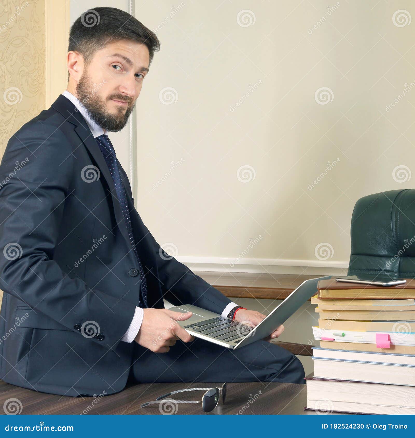 Successful Business Man Sitting at Office Table and Working with Laptop ...