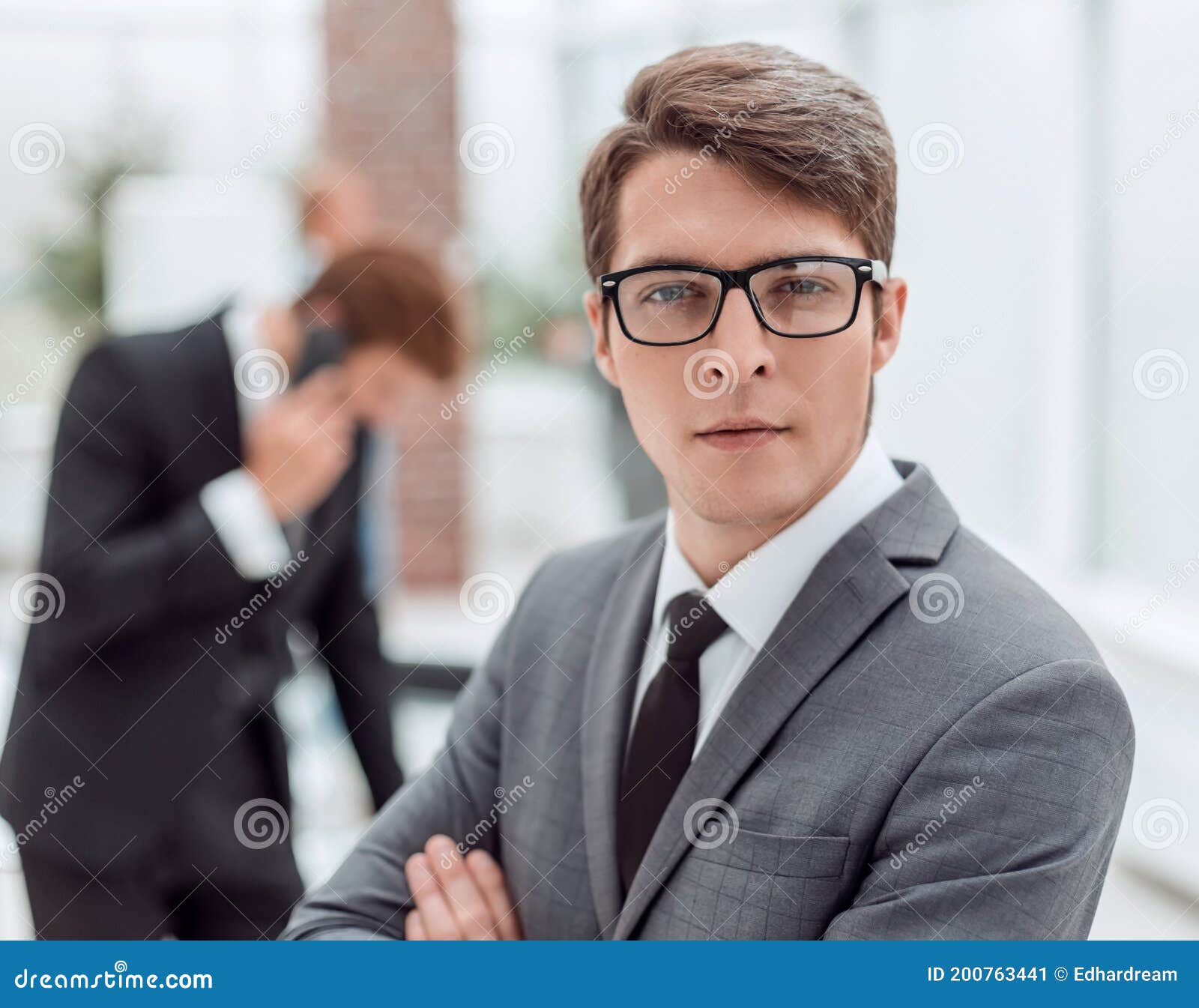 Successful Business Man Standing in a Modern Office. Stock Image ...