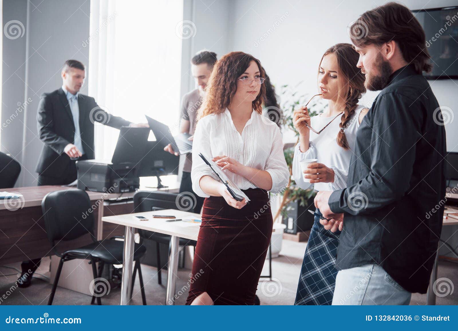 Successful Business People are Talking and Smiling during in Office ...
