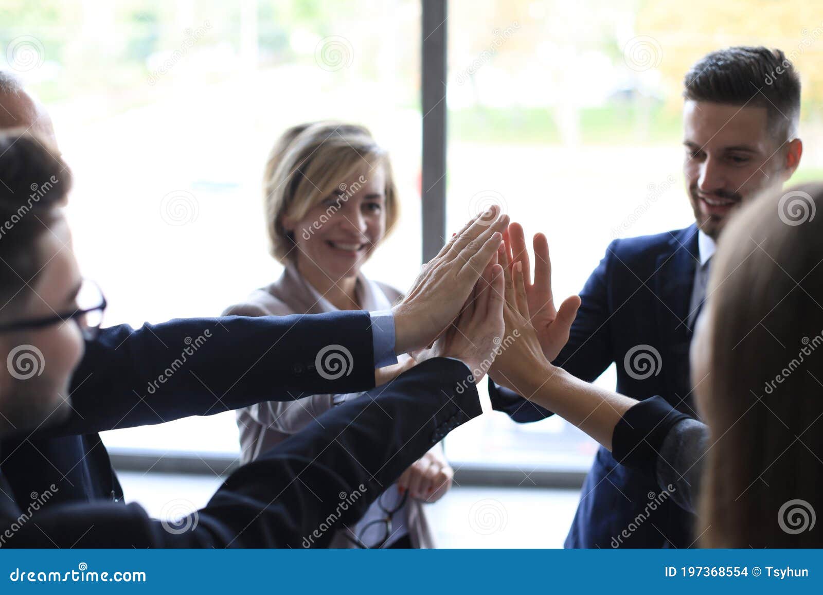 Successful Business Team Giving Each Other High Five Standing in the ...