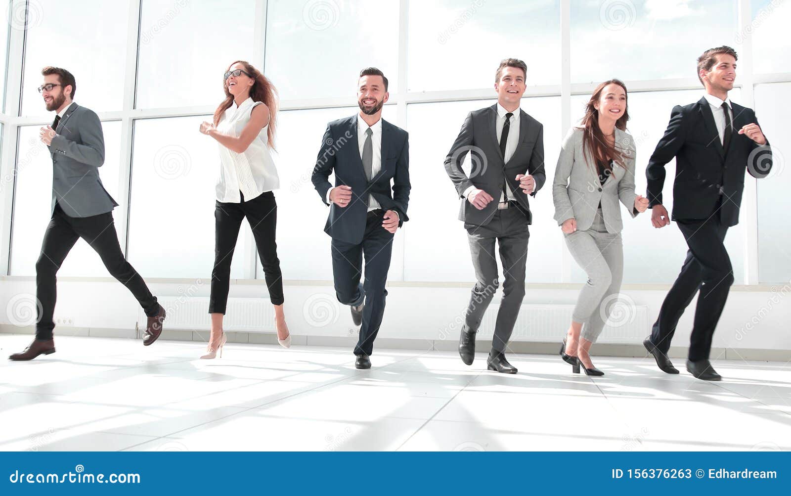 Successful Business Team Running in the Office Hall Stock Image - Image ...