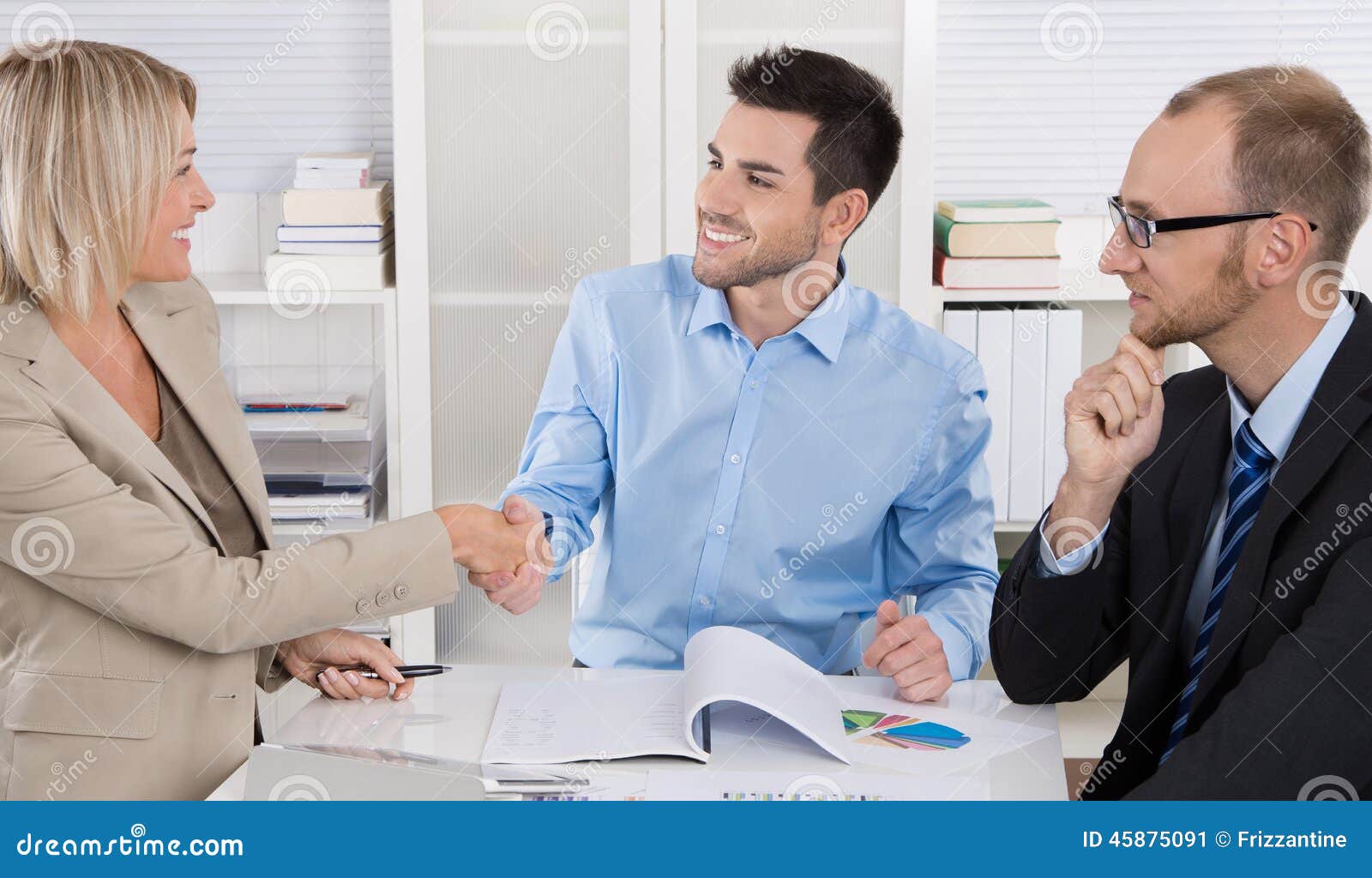 Successful Business Team Sitting Around a Table in a Meeting. Stock ...