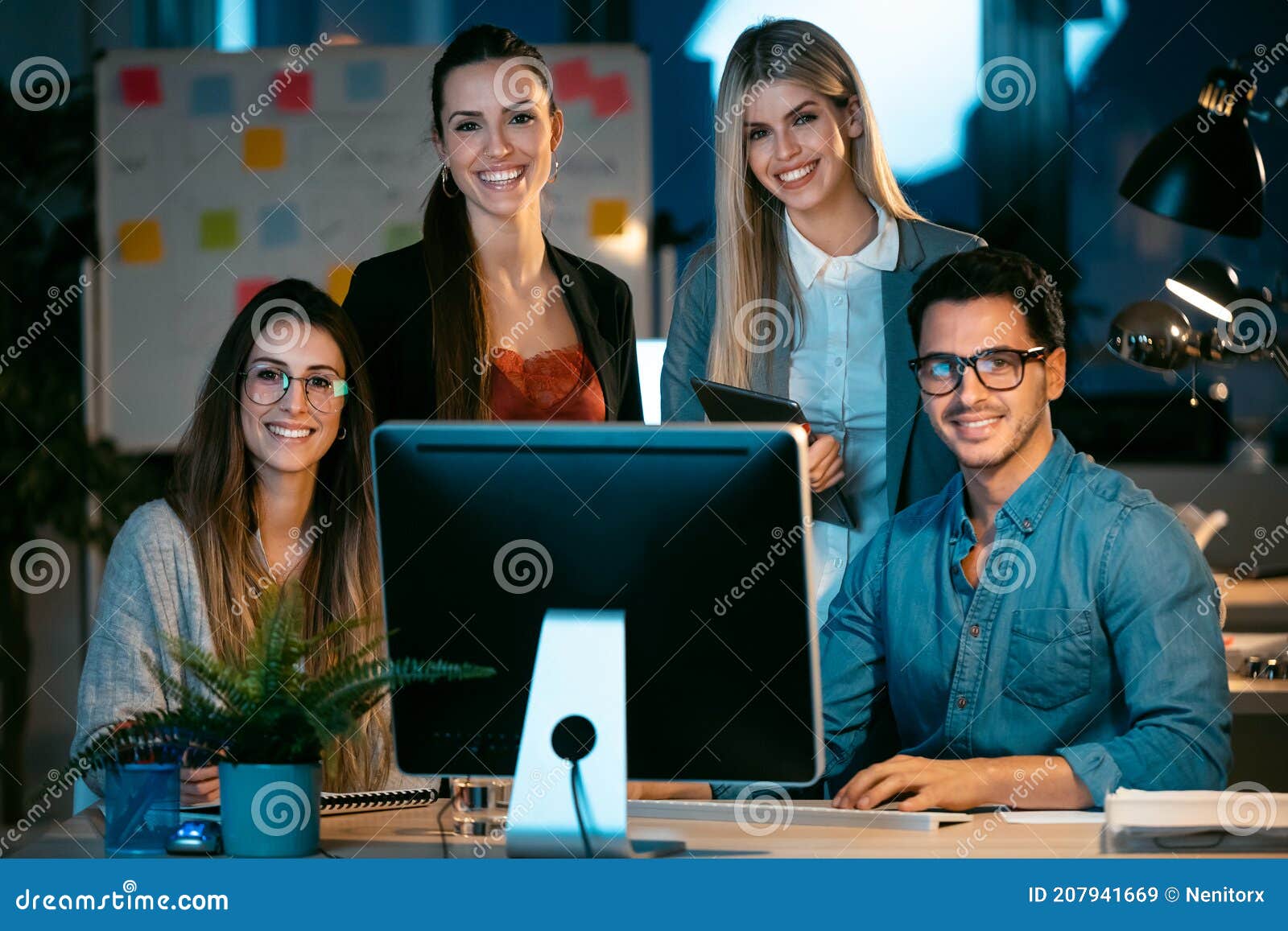 Successful Business Team Standing Around Computer for Presentation of ...
