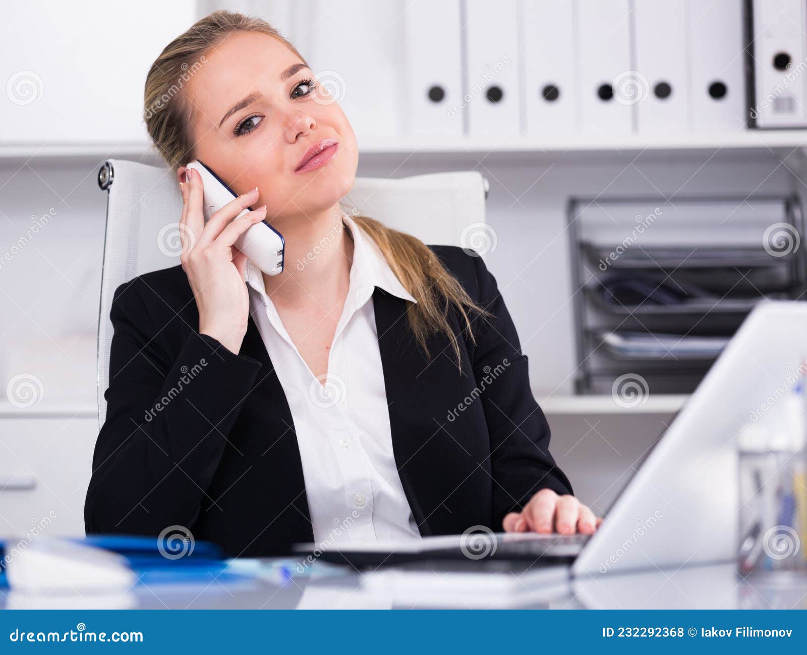 Business woman using phone stock photo. Image of laptop - 232292368