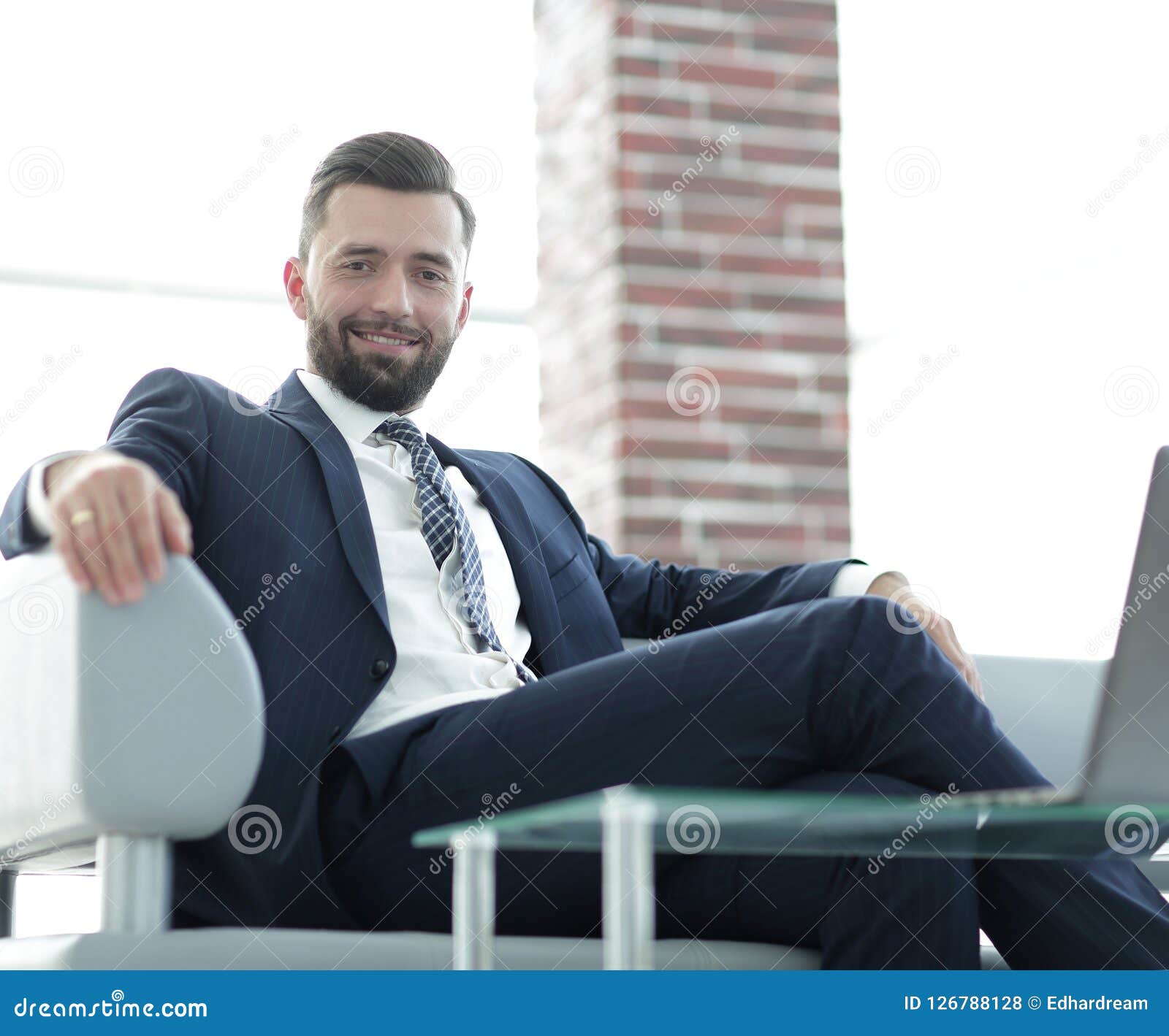 Portrait of a Successful Businessman Sitting in the Office Lobby. Stock ... Portrait of a Successful Businessman Sitting in the Office Lobby. Stock ...