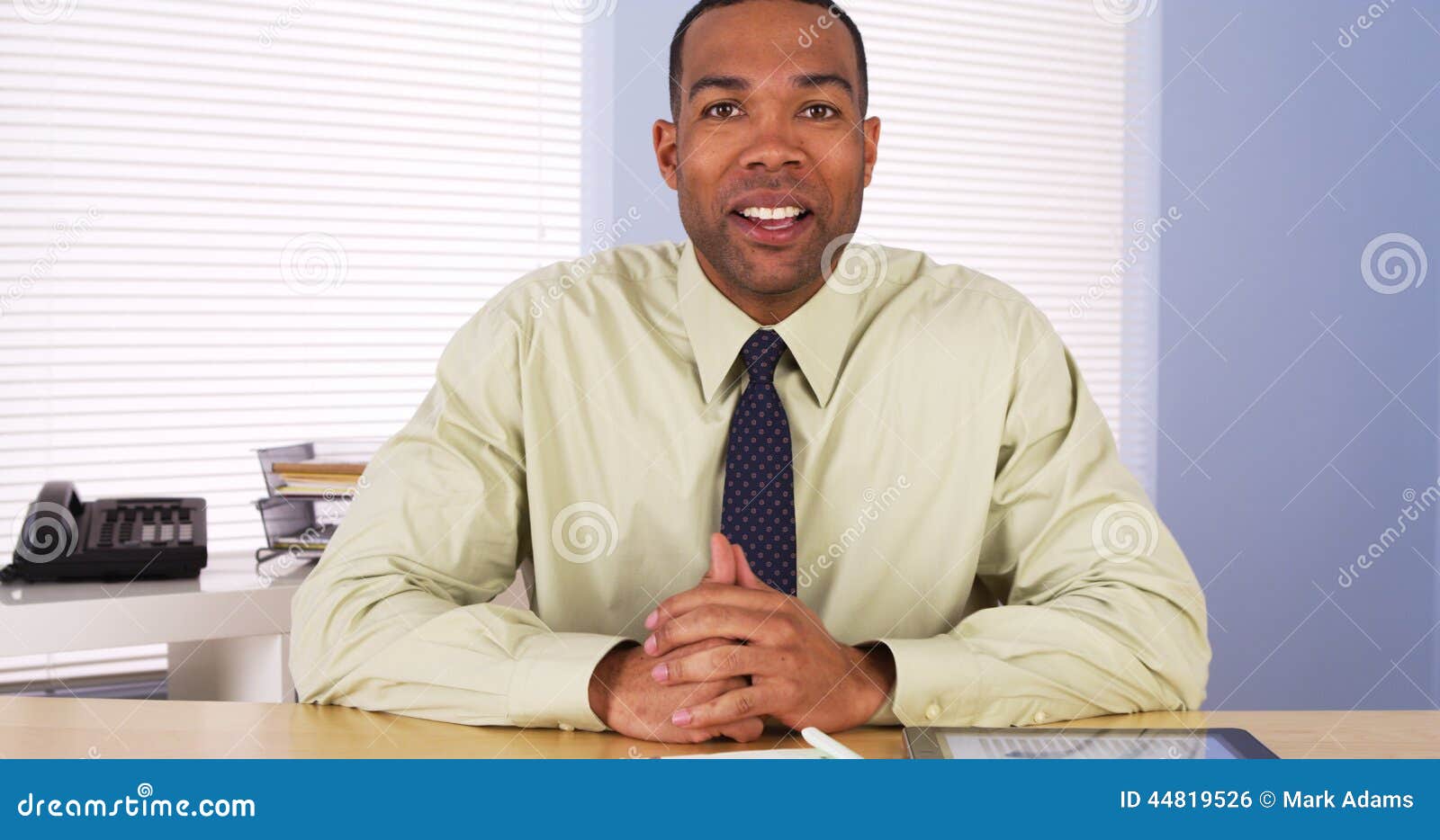 Successful Businessman Talking To Camera Stock Photo - Image of male ...