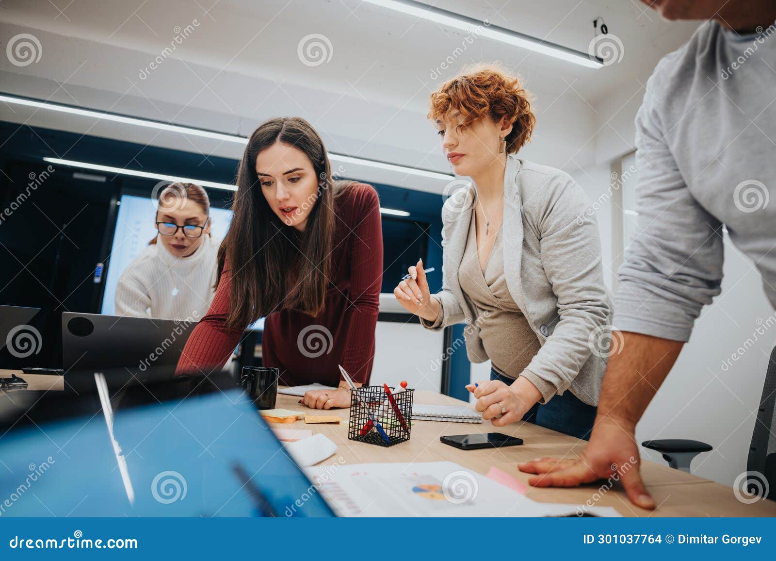 Successful Businesspeople Collaborating and Sharing Ideas in a Dynamic ...