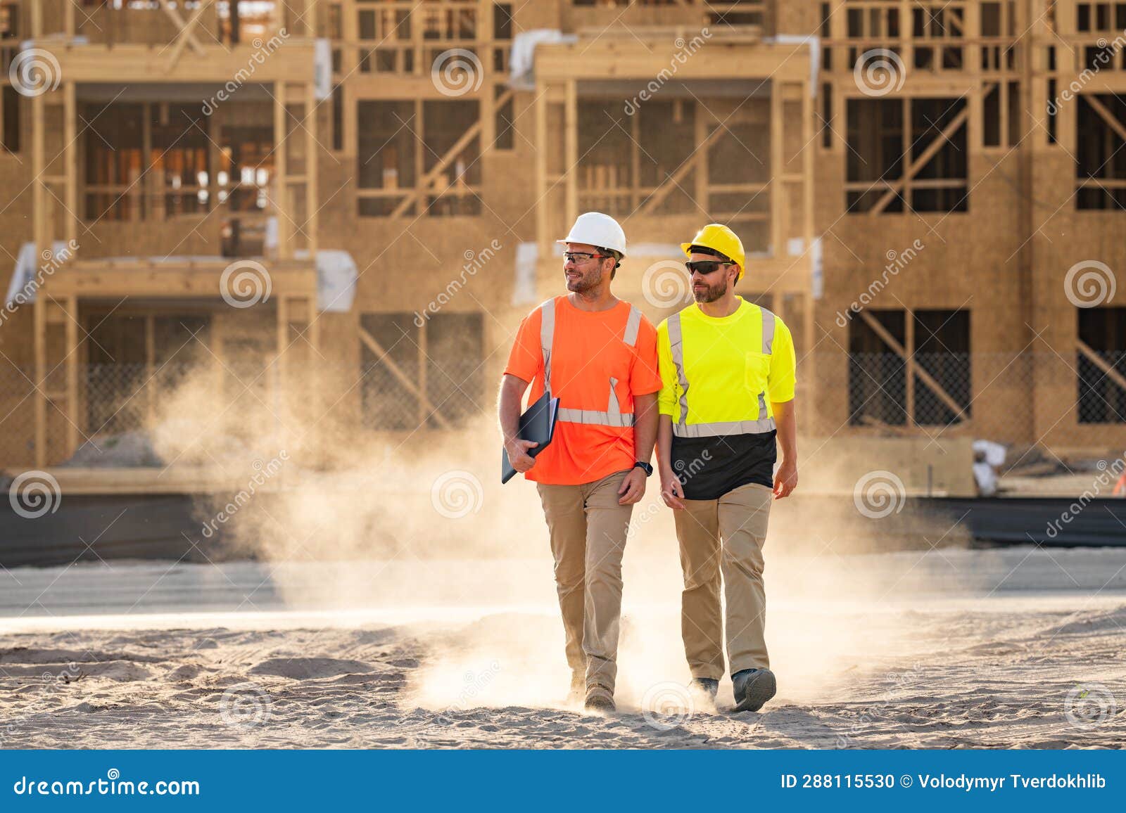 Successful Construction Site Workers with Builders Equipment ...