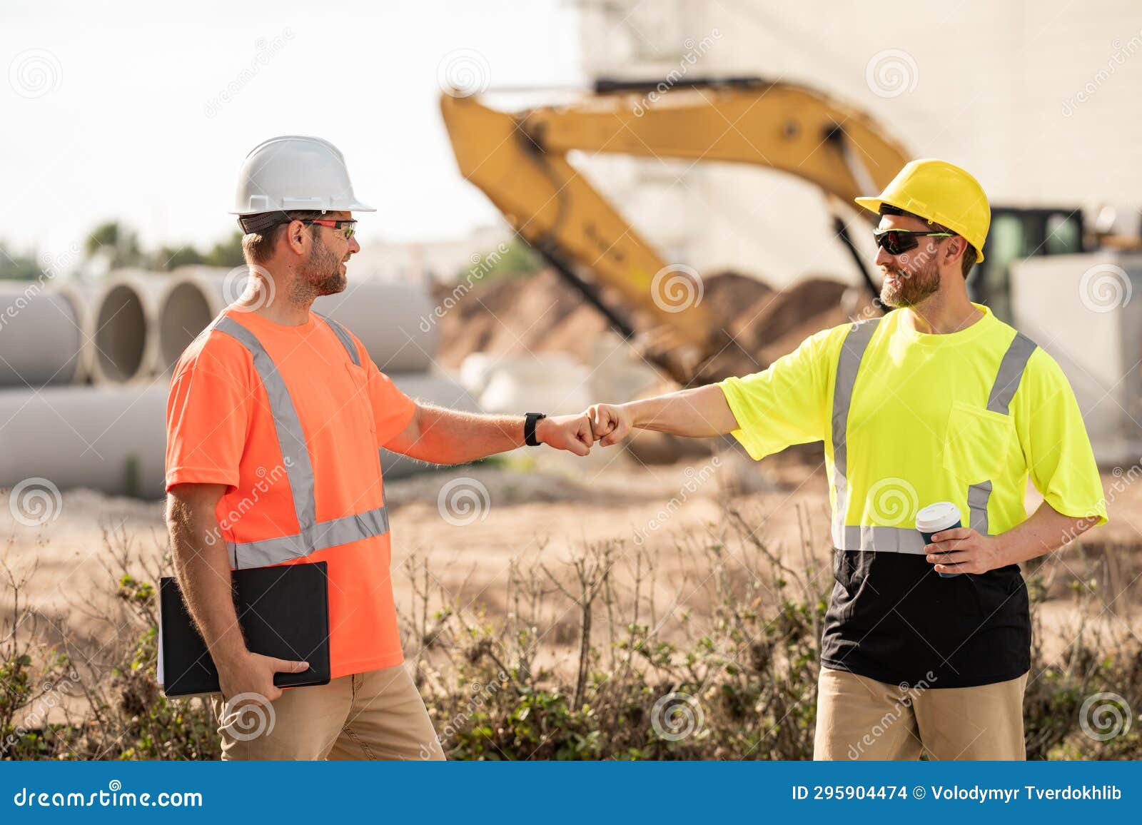 Successful Construction Site Workers with Builders Equipment ...