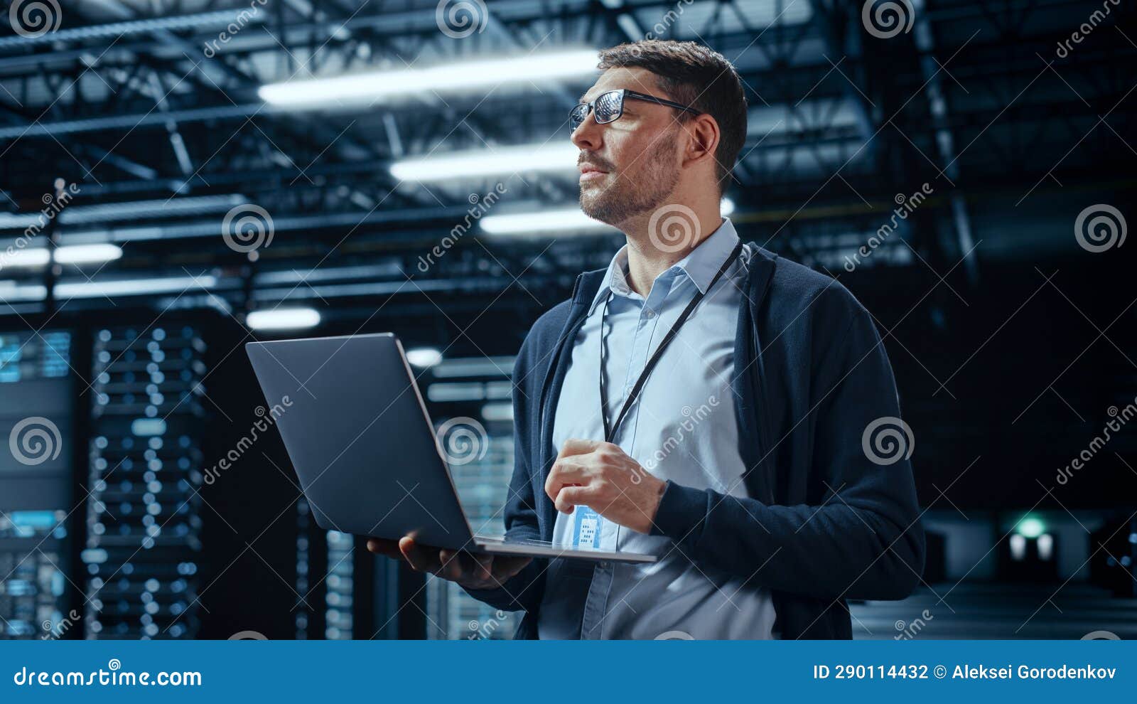 Successful Data Center it Specialist Using Laptop Computer. Server Farm Cloud Computing Facility ...