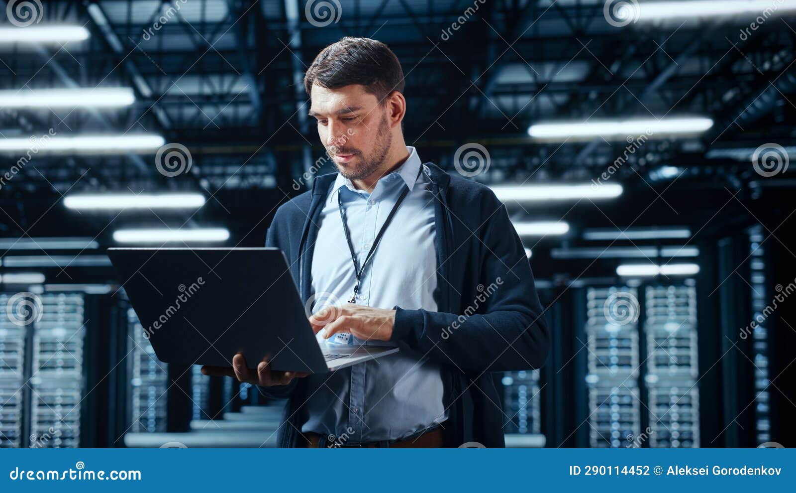 Successful Data Center it Specialist Using Laptop Computer. Server Farm Cloud Computing Facility ...