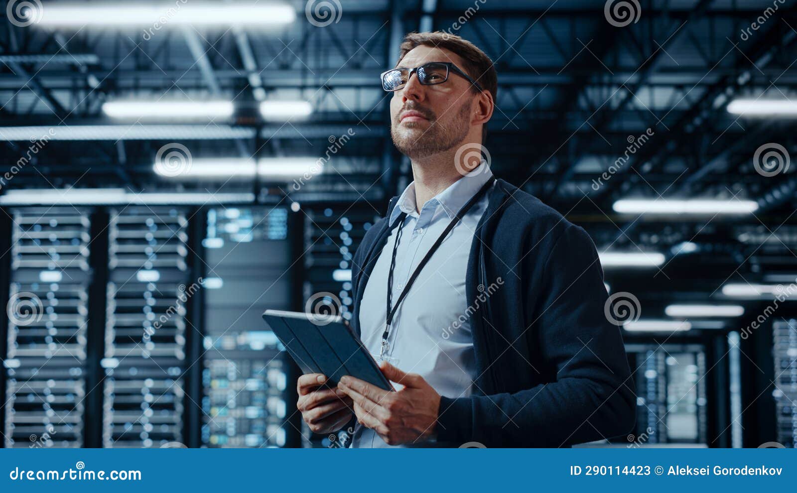 Successful Data Center it Specialist Using Tablet Computer. Server Farm ...