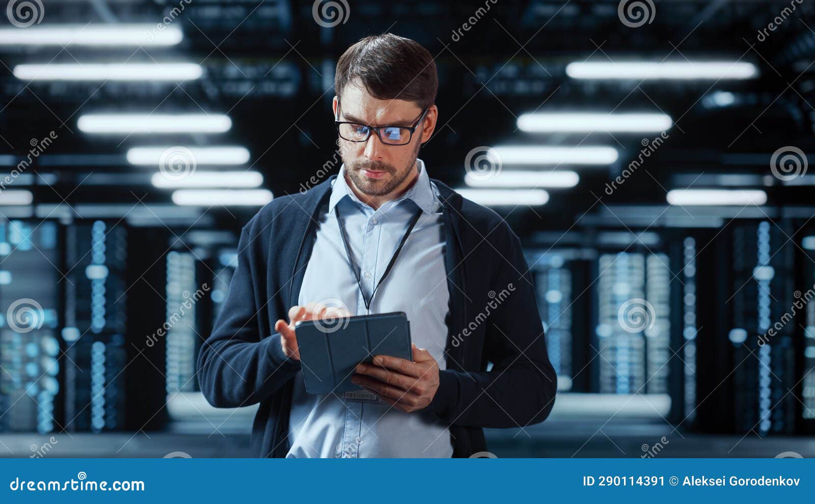 Successful Data Center it Specialist Using Tablet Computer. Server Farm Cloud Computing Facility ...