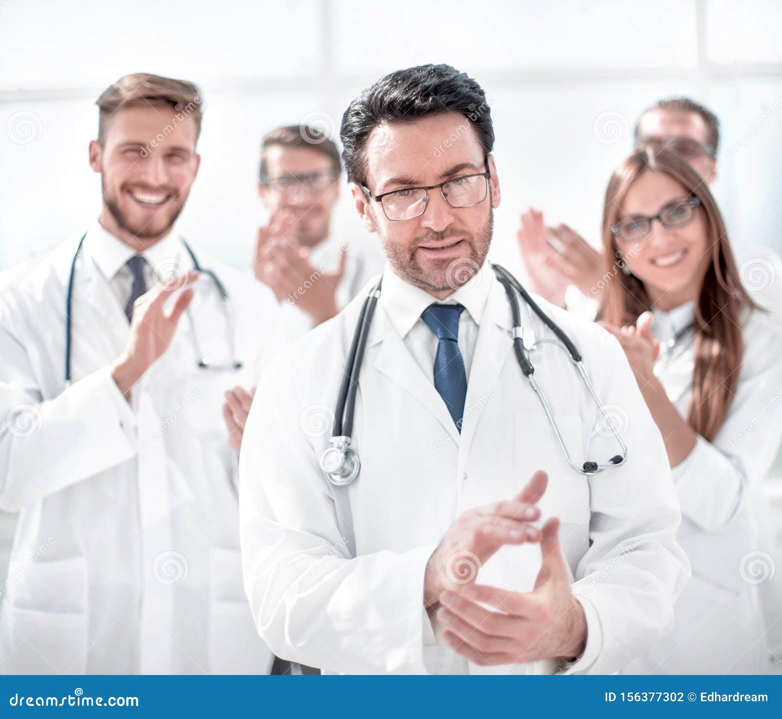 Successful Doctor, Accepting Congratulations from Colleagues Stock ...