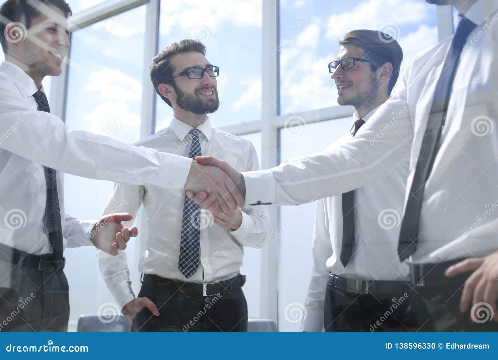 Successful Employees Shaking Hands at the Workplace in the Office ...