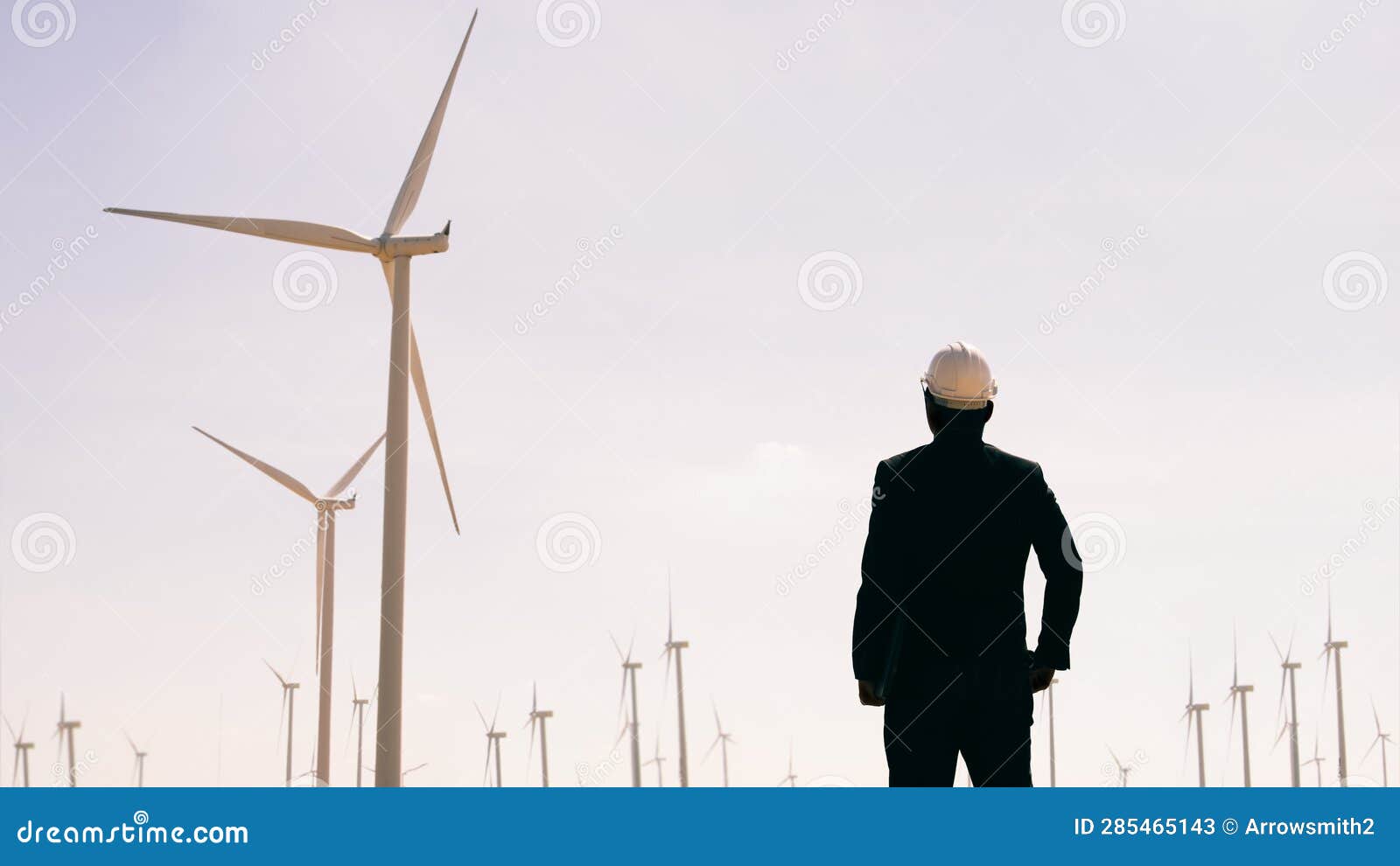 Successful Engineer Man Stands Front the Wind Turbines Generating ...