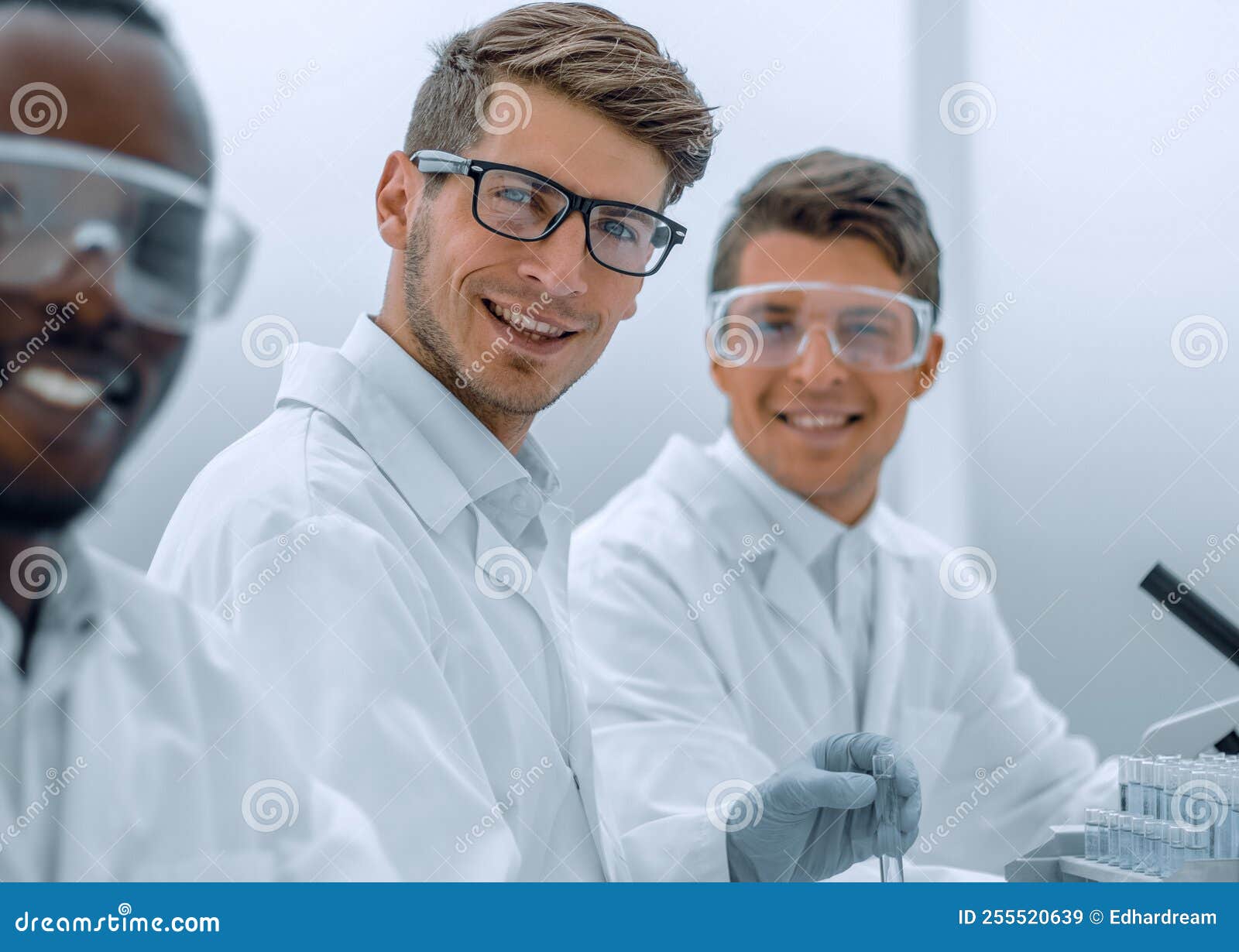 Successful Group of Scientists Sitting at Their Desk Stock Image ...