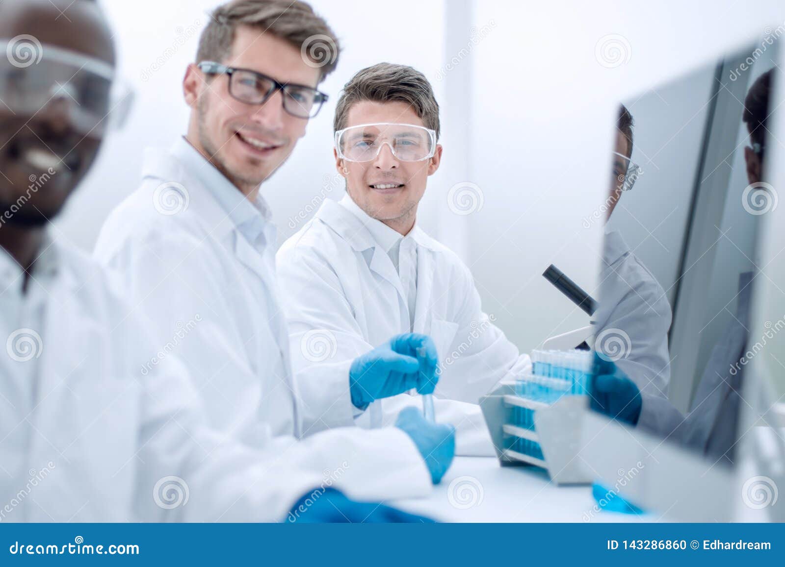 Successful Group of Scientists Sitting at Their Desk Stock Photo ...