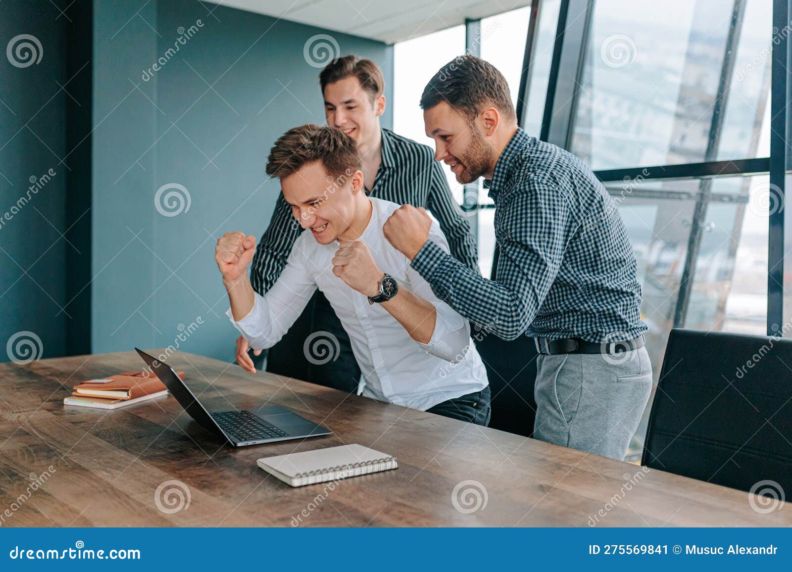Successful Group of Three Men with Laptops in the Office Stock Image ...