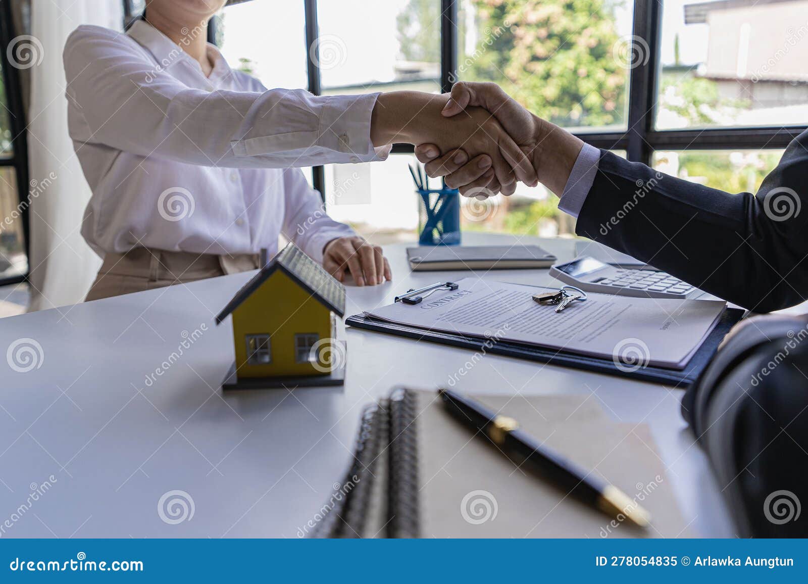Successful Handshake and Agreement Real Estate Agent and Client ...