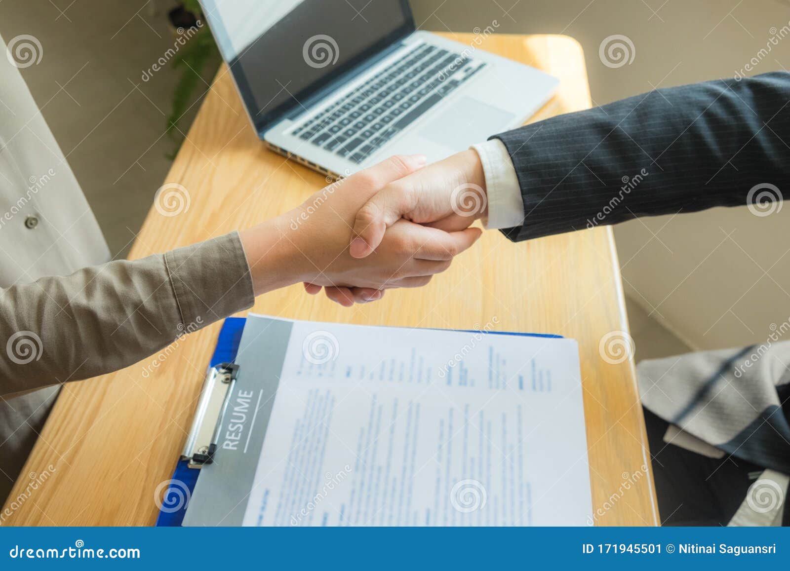 Successful Handshake in Presenting Resume for Work in the Company Stock ...