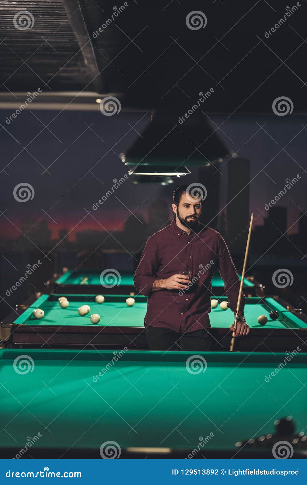Successful Handsome Man Standing beside Pool Table with Drink Stock ...