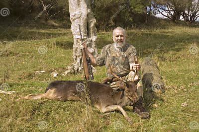 Successful Hunter and Prize Stock Photo - Image of antlers, wild: 6953062