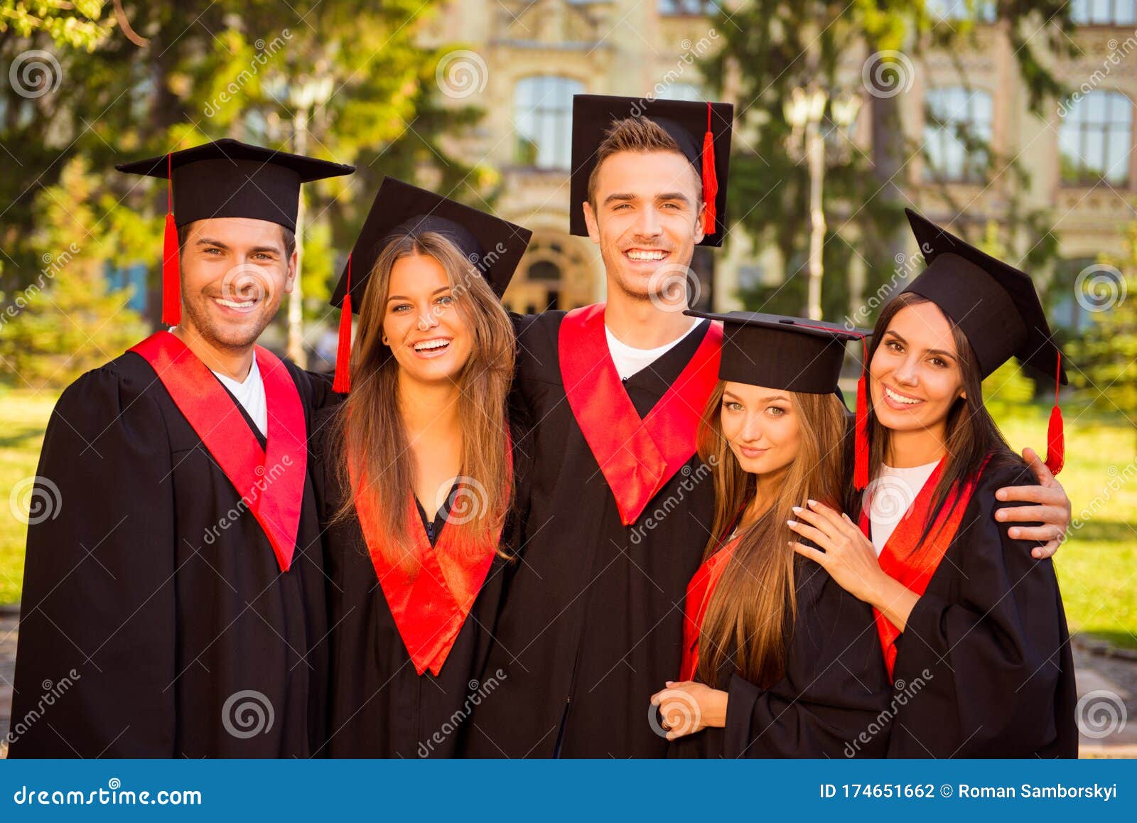 Successful Joyful Five Graduates in Robes and Hats Smiling and Hugging ...