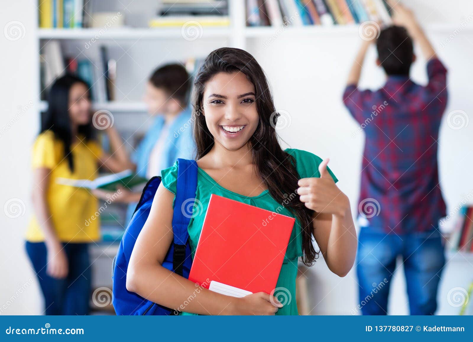 Successful Latin American Female Student with Group of Students Stock ...
