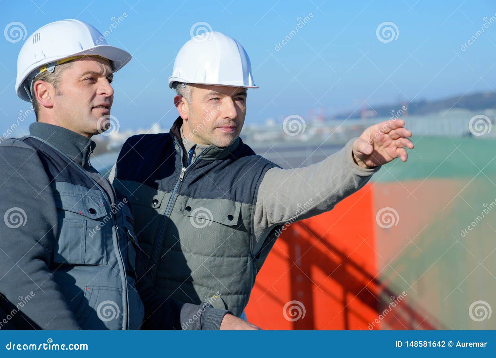 Successful Male Builders Pointing it Outdoors Stock Photo - Image of ...