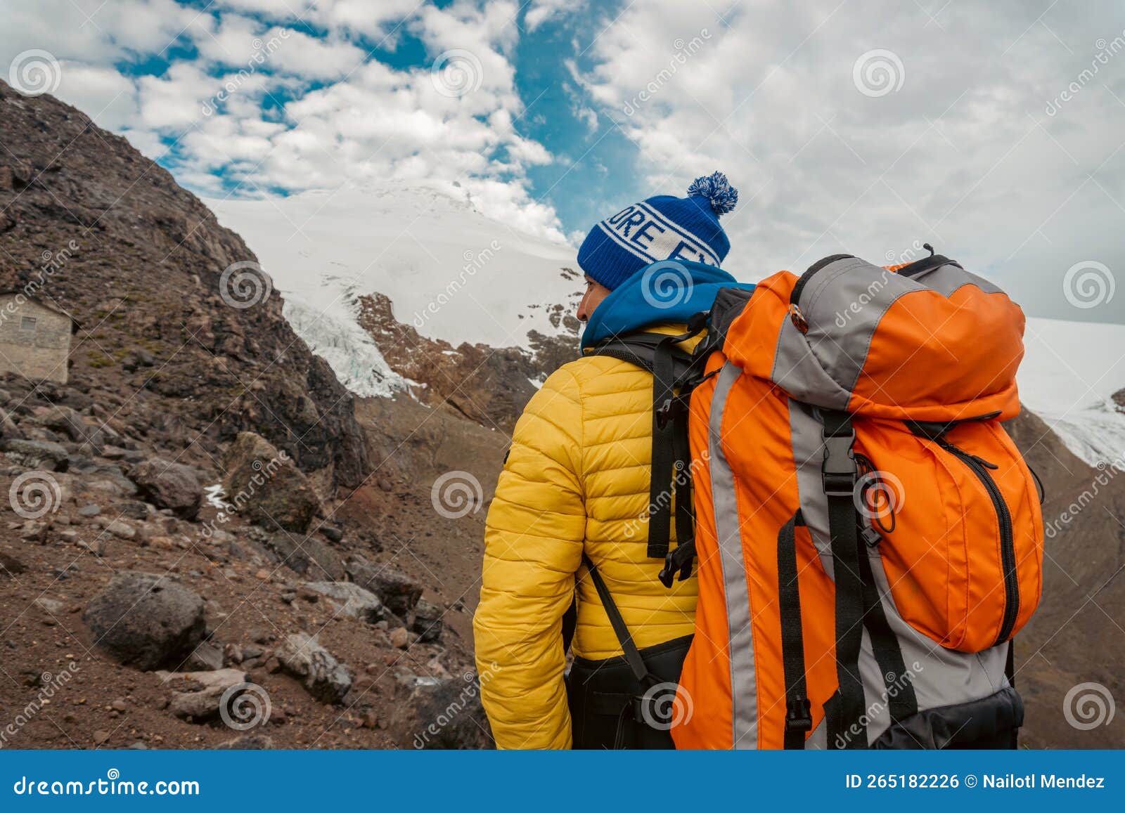 Man Hiker with Backpack in Front of a Mountain Stock Photo - Image of ...