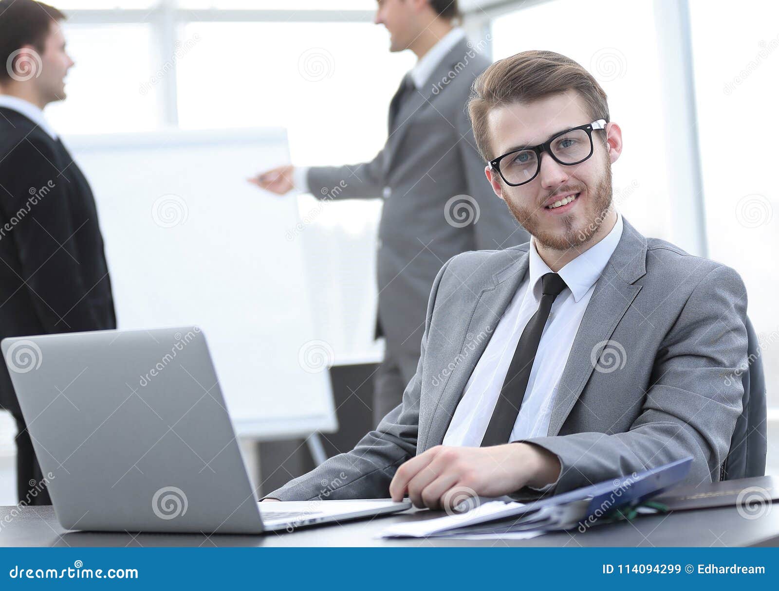 Successful Businessman Sitting at Desk in Office Stock Image - Image of ...