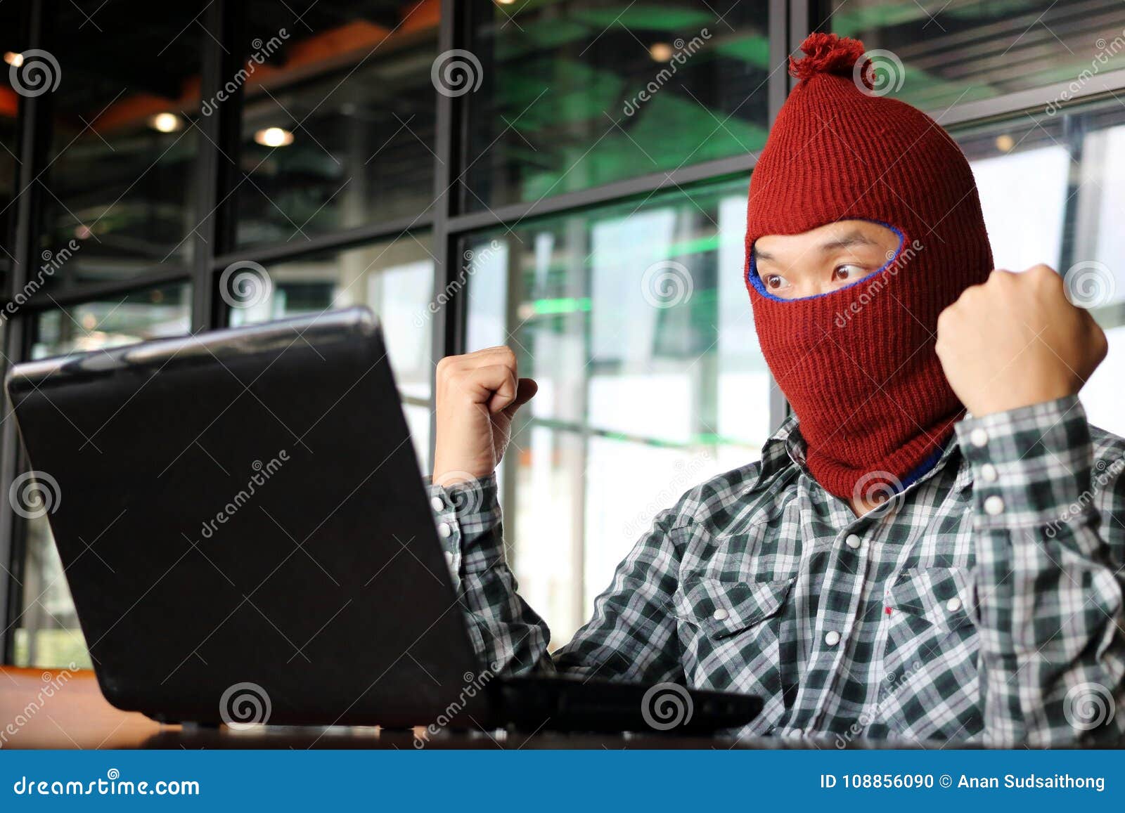 Successful Masked Hacker Wearing a Balaclava Raising Hands after ...