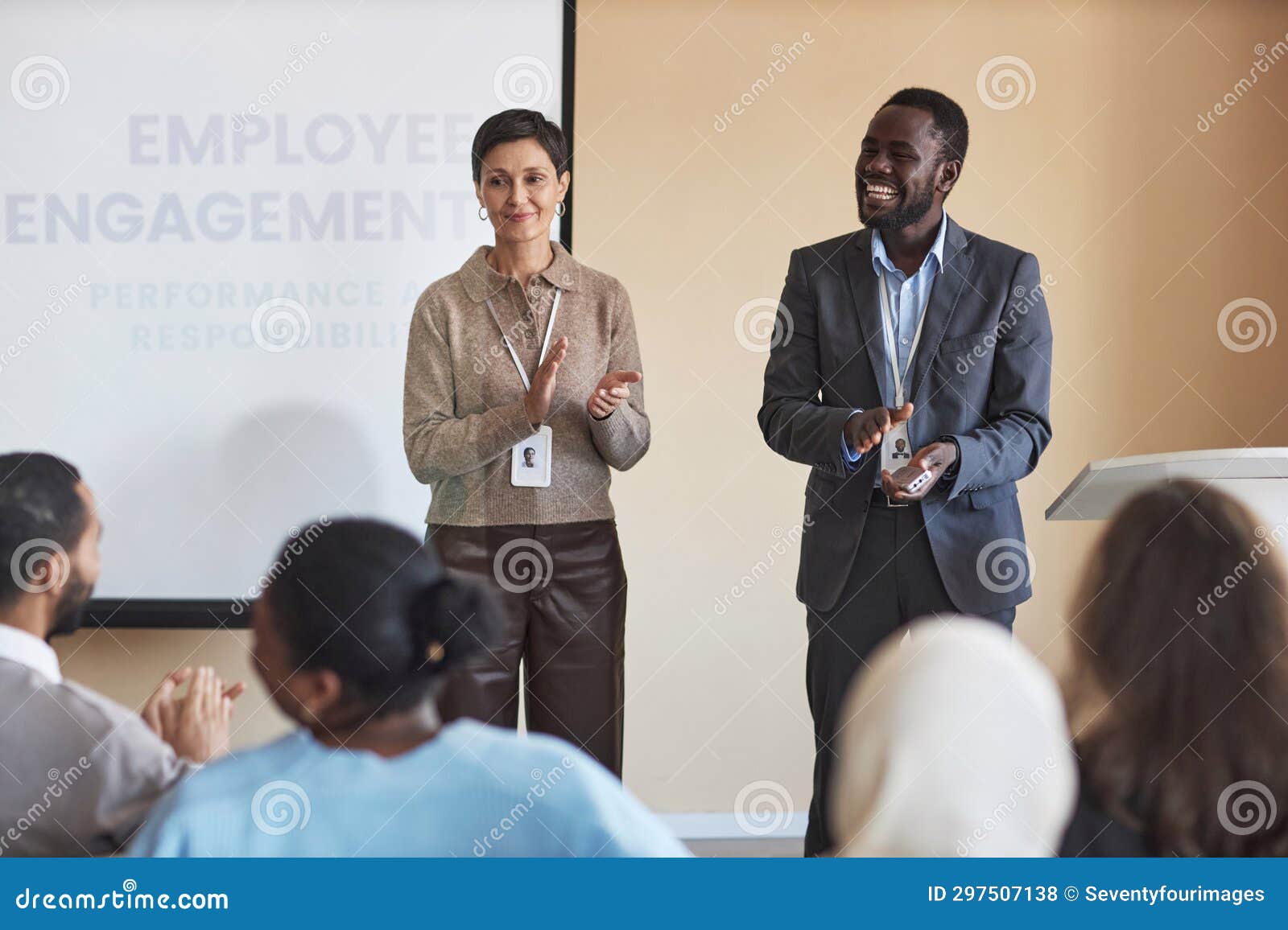 Successful Mature Coach and Her Assistant Clapping Hands in Front of ...