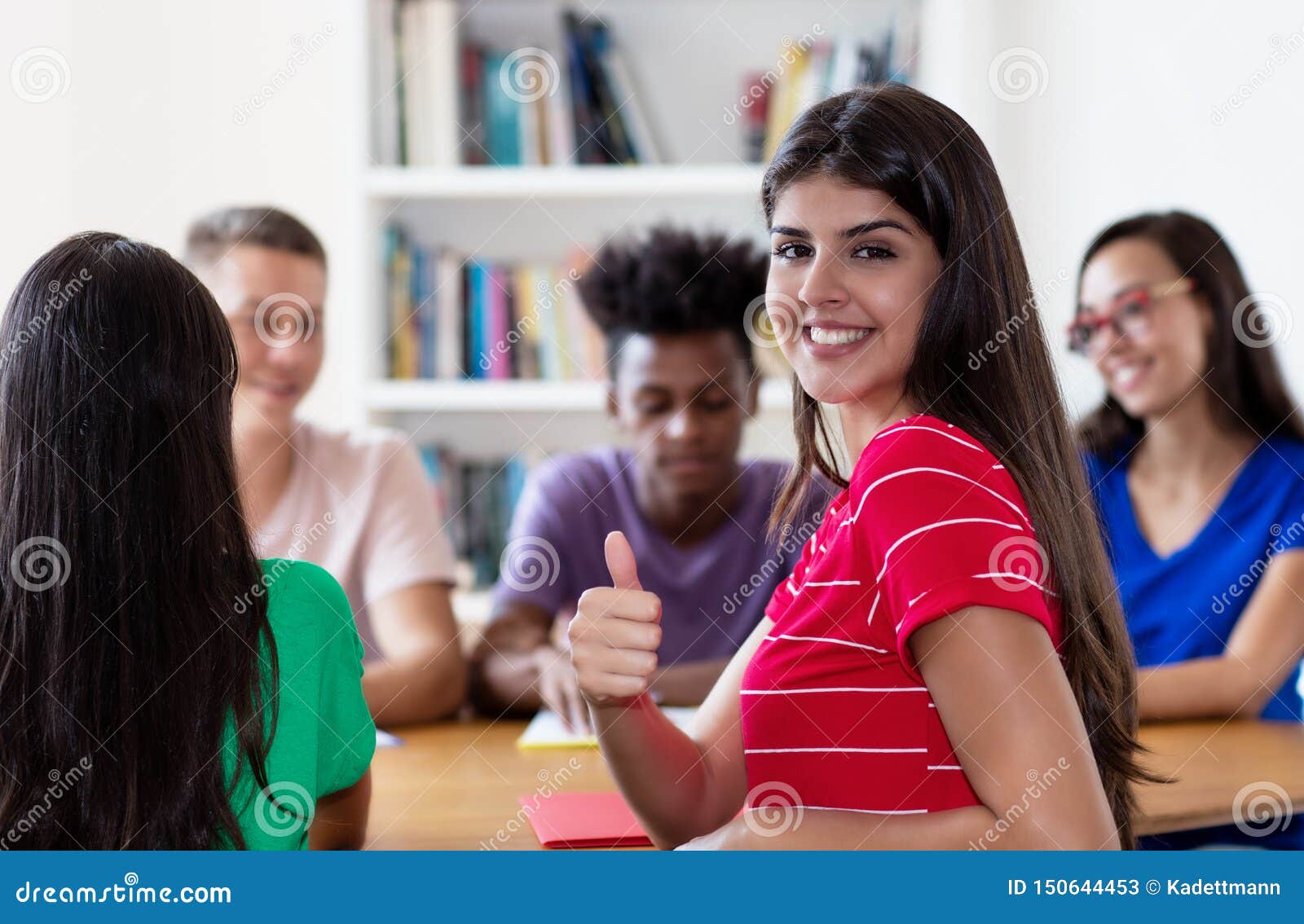 Successful Mexican Female Student Learning with Group of Students Stock ...