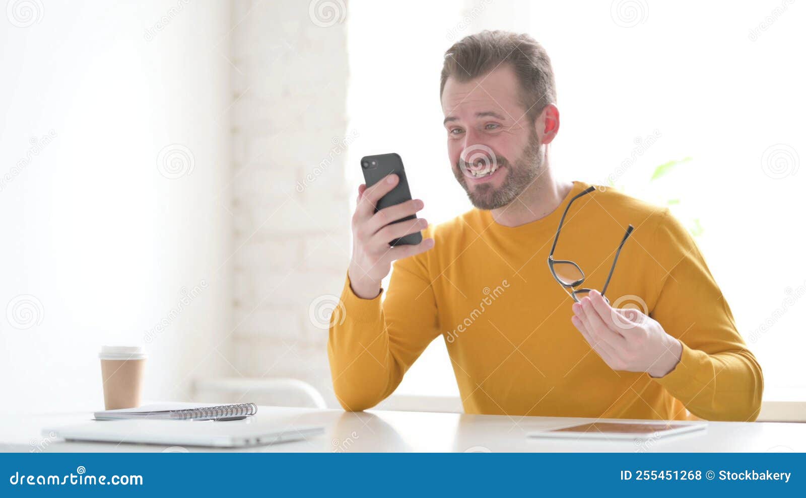 Successful Man Celebrating on Smartphone Stock Photo - Image of working ...