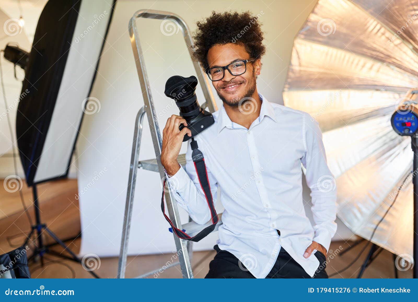 Successful Photographer in the Photo Studio with Camera Stock Photo ...