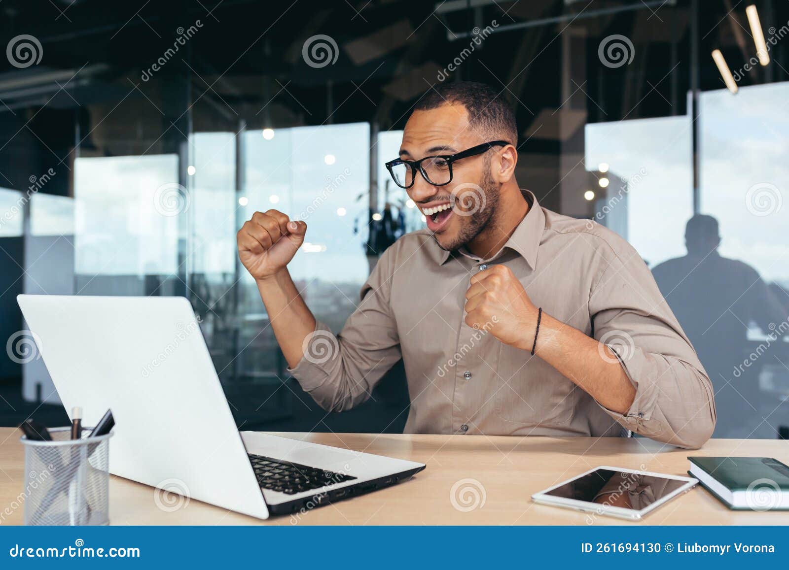 Successful Programmer in Office with Laptop Celebrating Successful ...