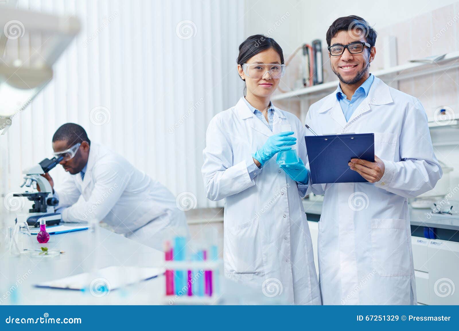 Successful scientists stock image. Image of intercultural - 67251329
