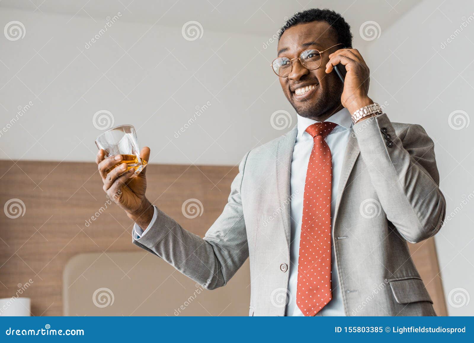Successful Smiling African American Businessman Holding Glass of ... Successful Smiling African American Businessman Holding Glass of ...