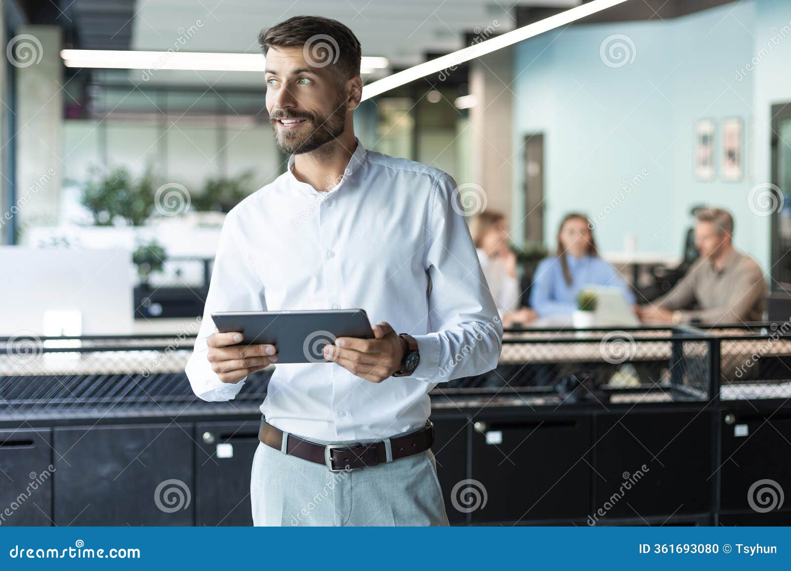 Successful Smiling Ceo is Standing in Modern Office and Looking at ...