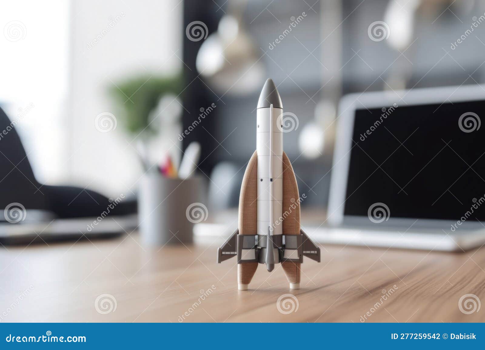 Successful Startup Concept. Launching Rocket on Office Table ...