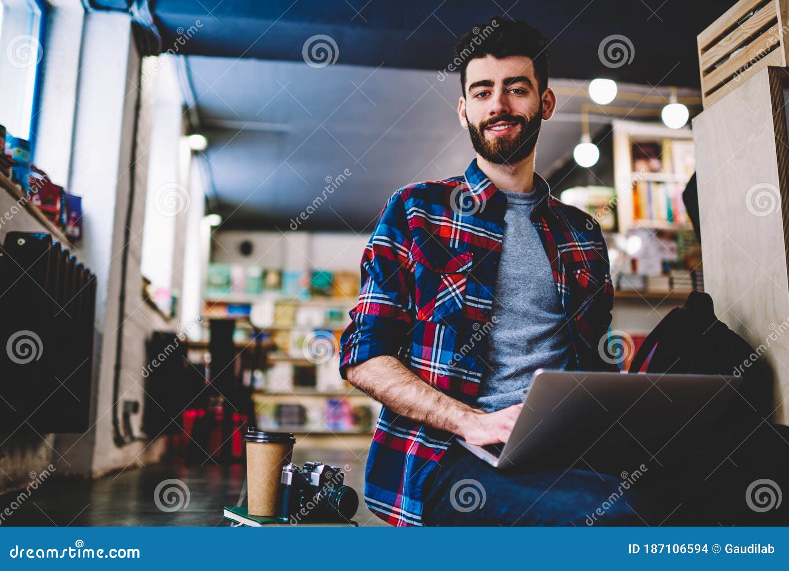 Successful Student Sitting in Library and Working on Course Work Using ...