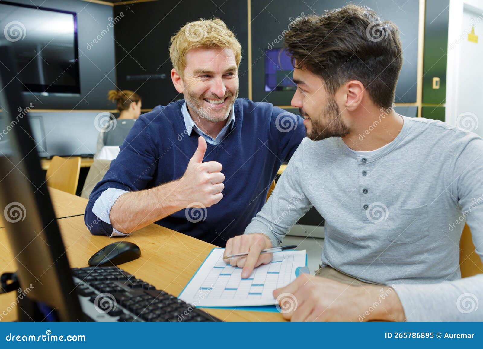 Successful Teacher in Class Holding Thumbs Up with Student Stock Image ...