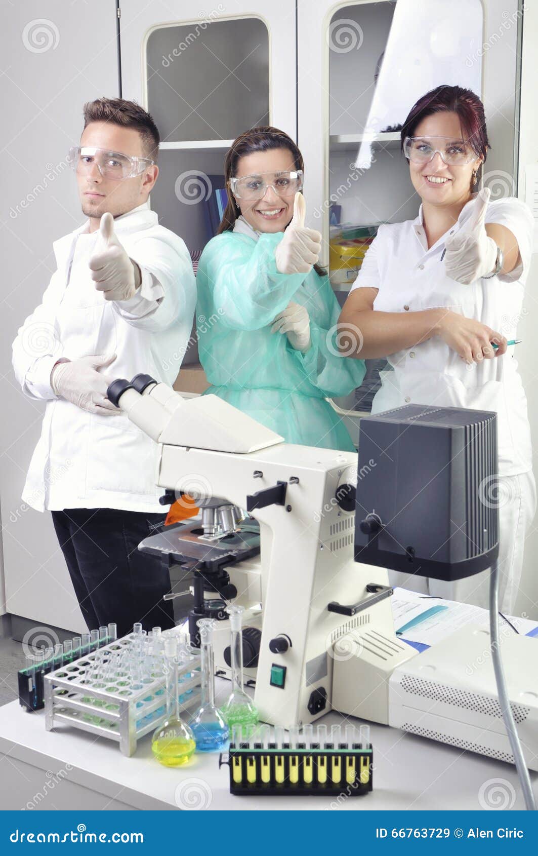 Successful Teamwork Inside the Lab. Scientists Looking at Camera ...