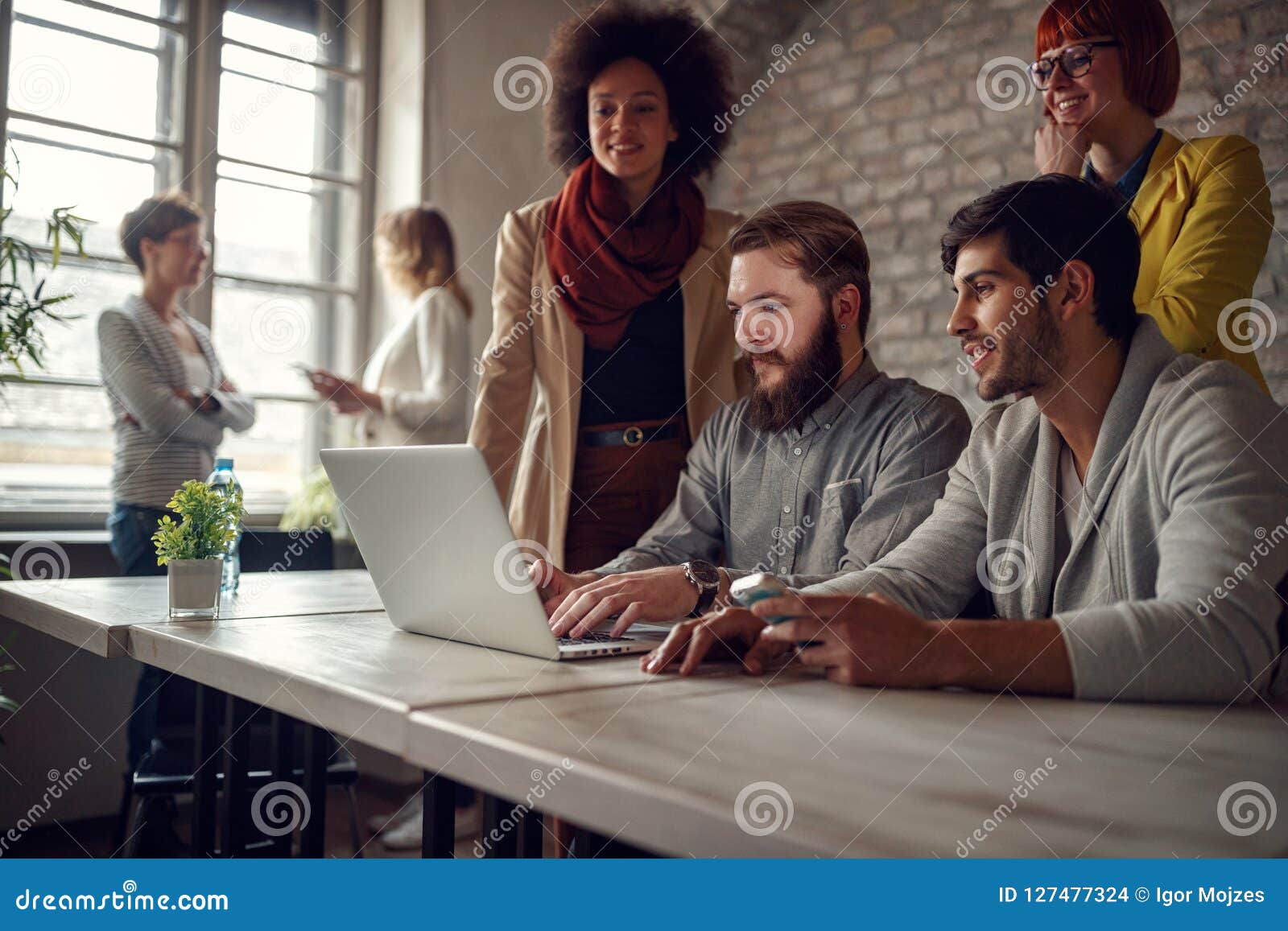 Teamwork. Young Man And Woman, Clerks In Business Clothes Sitting On ...