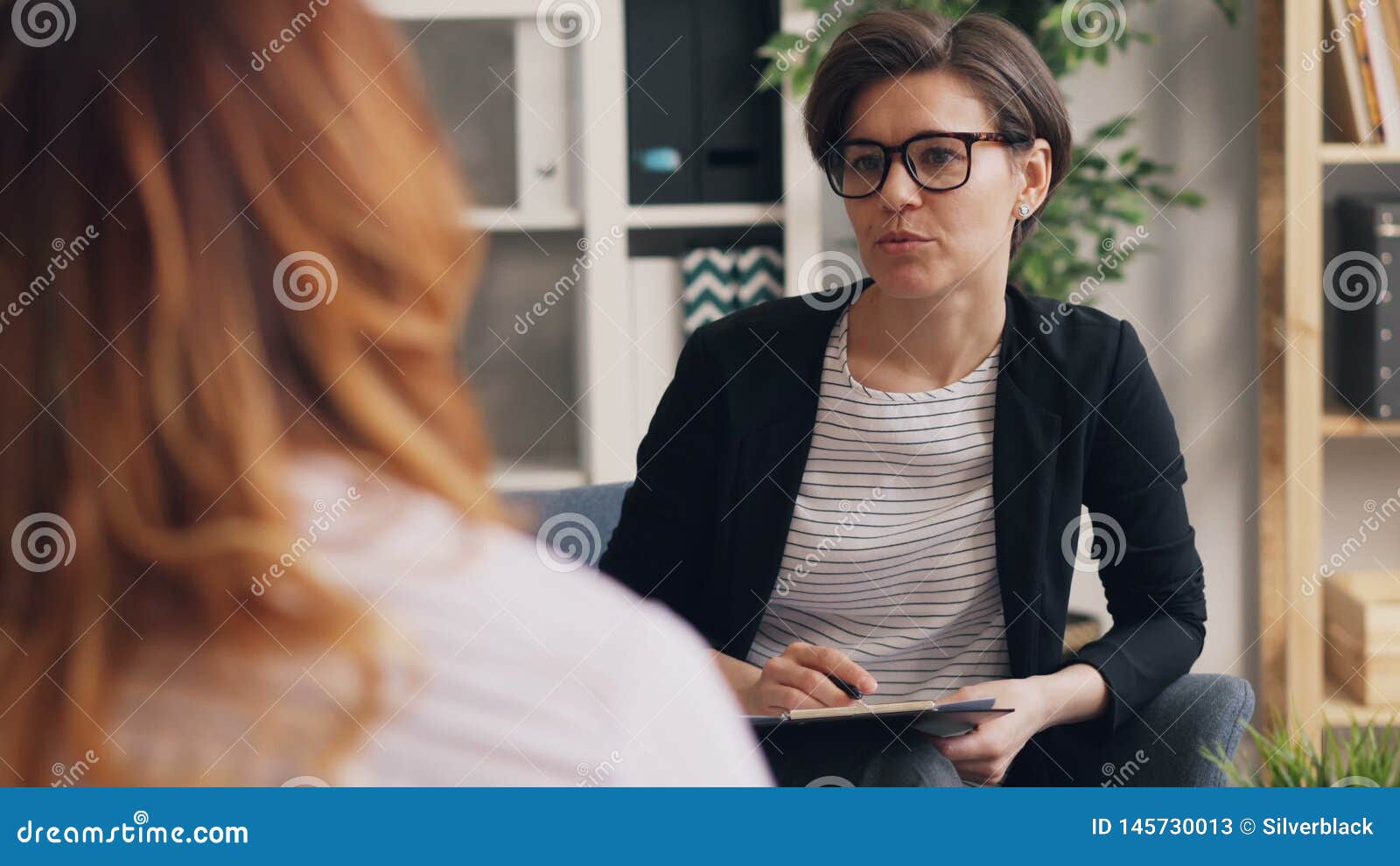 Successful Therapist Discussing Problems with Client Sitting in Office ...