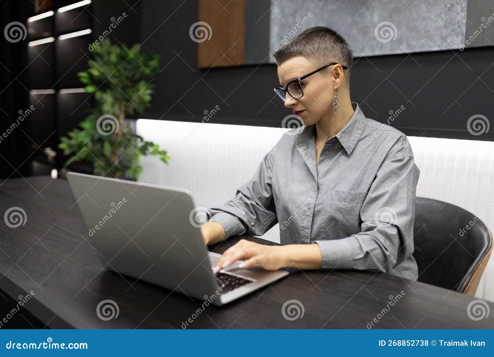 Successful Woman Programmer Working in a Stylish Office Behind a Laptop ...